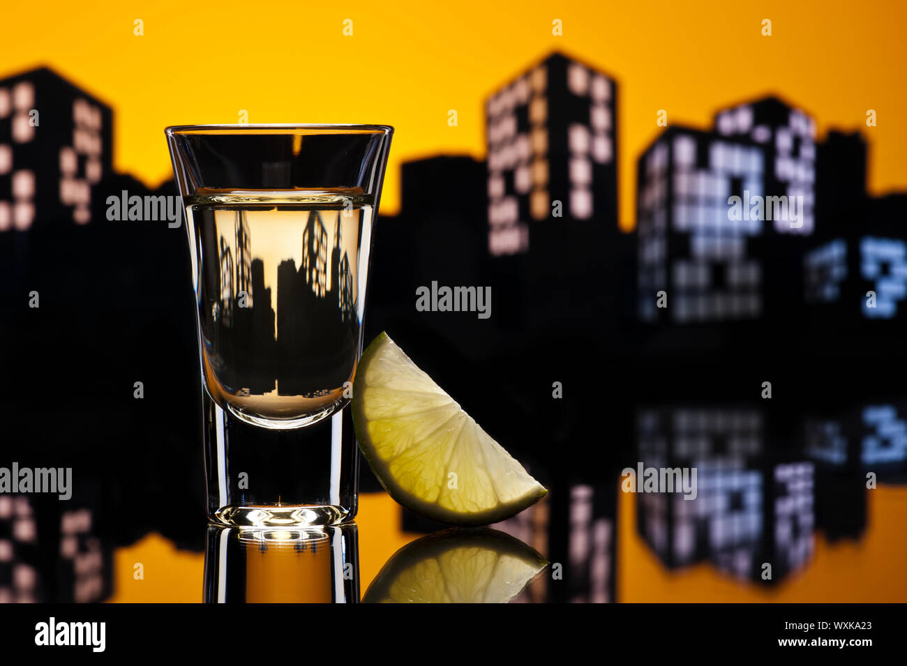 Tequila shoot in colorfull cityscape setting Stock Photo - Alamy