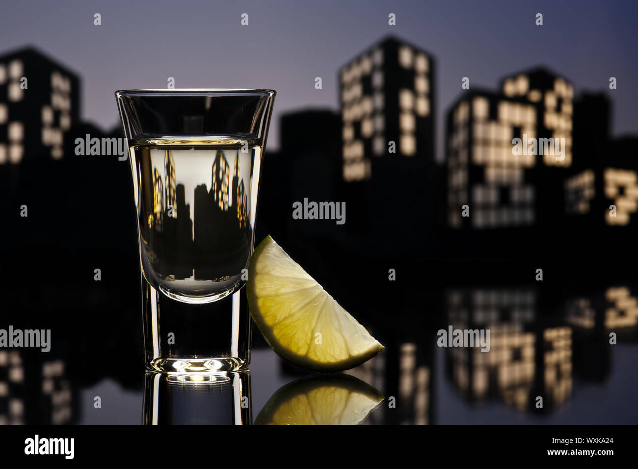 Tequila shoot in colorfull cityscape setting Stock Photo - Alamy