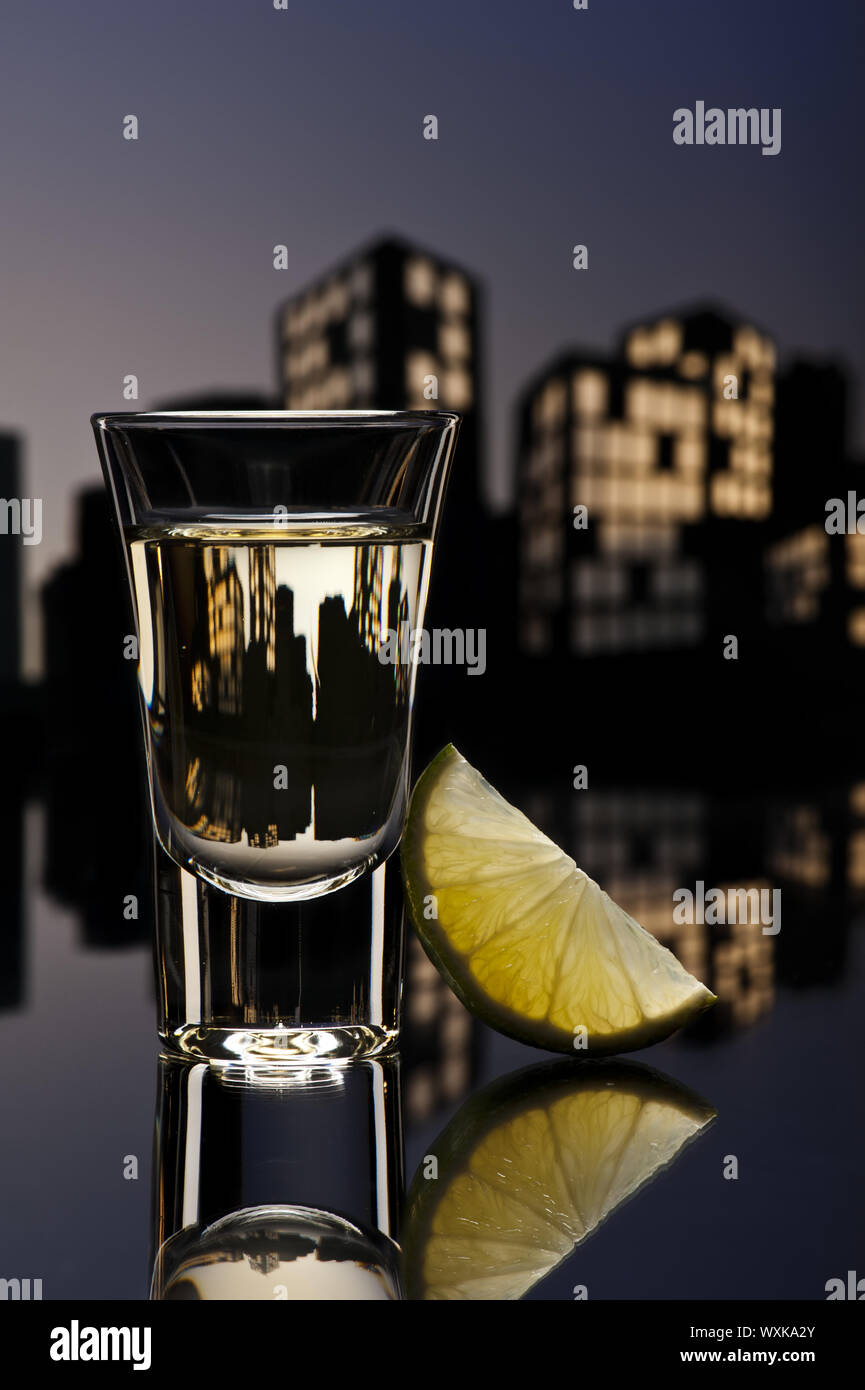 Tequila shoot in colorfull cityscape setting Stock Photo - Alamy
