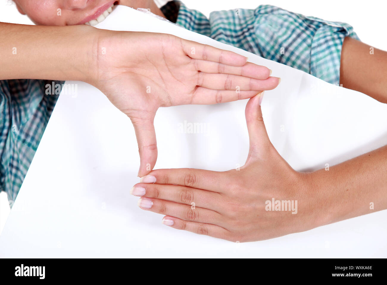woman biting a paper and making a sign Stock Photo - Alamy