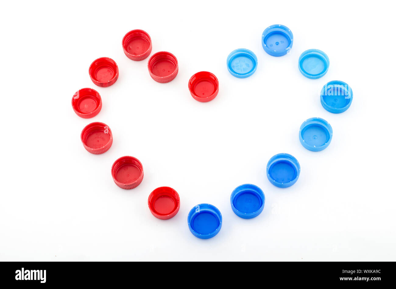 red blue heart bottle cap isolated on white background Stock Photo - Alamy