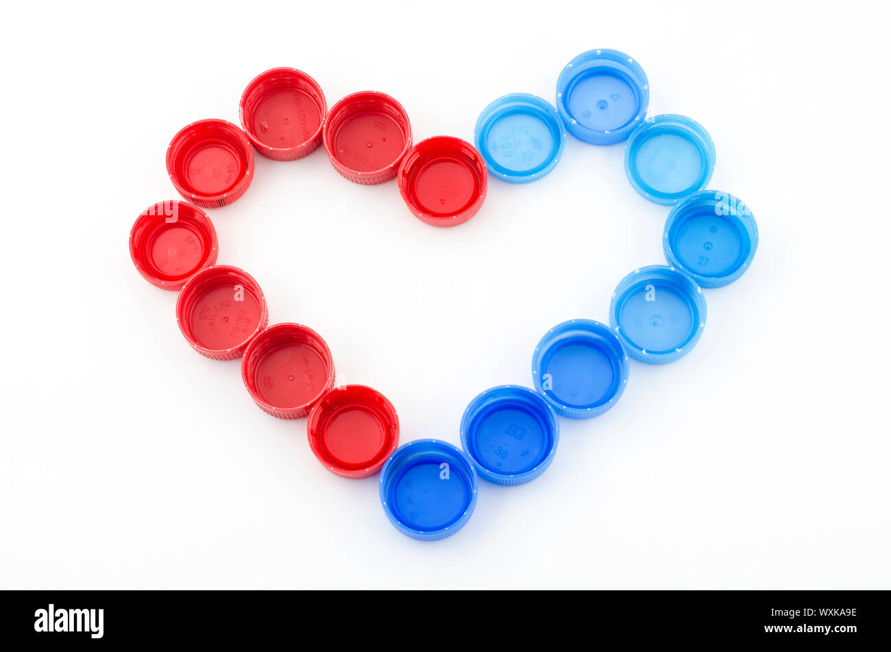 red blue heart bottle cap isolated on white background Stock Photo - Alamy
