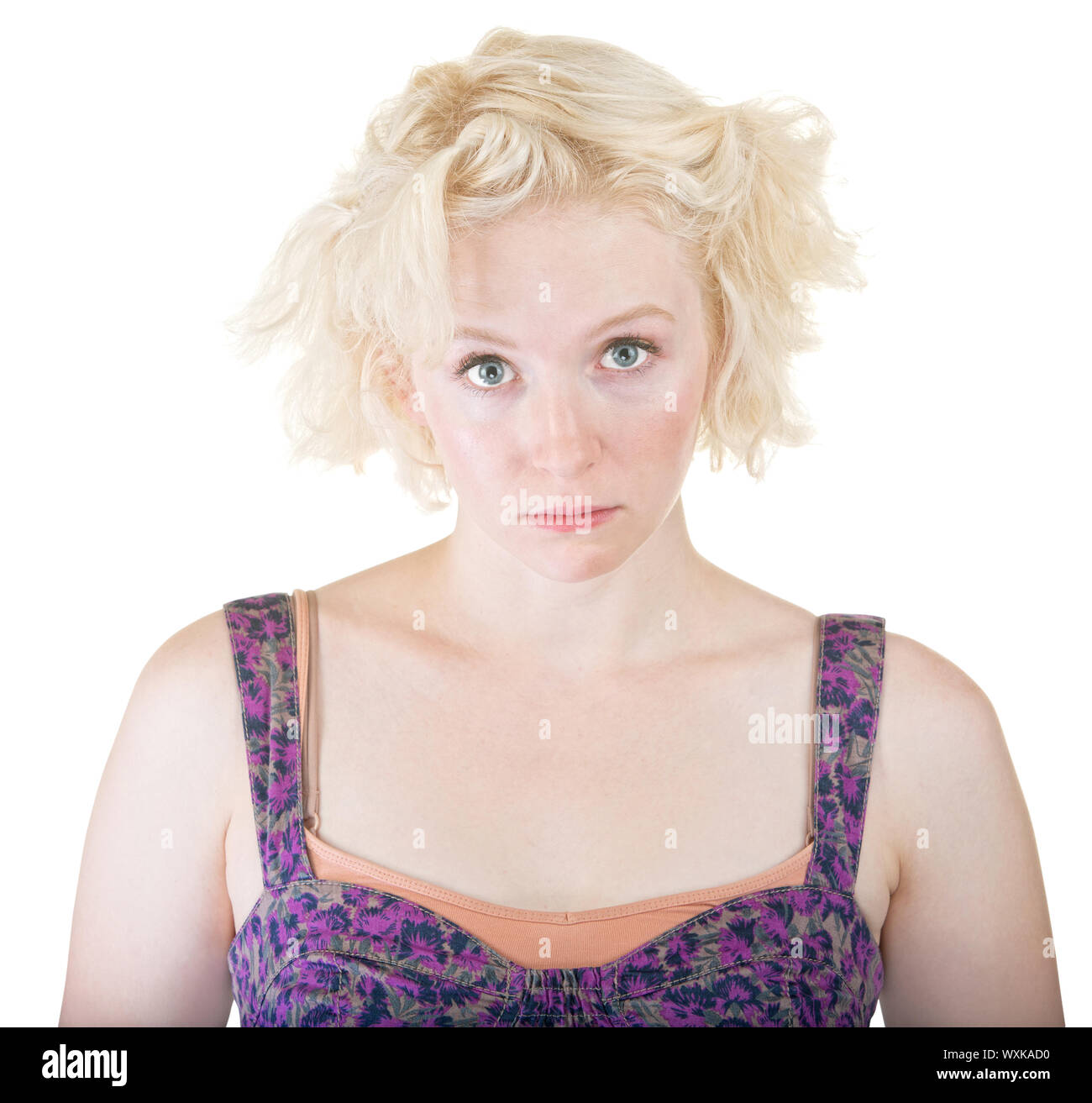 Serious Caucasian female in purple dress on isolated background Stock ...