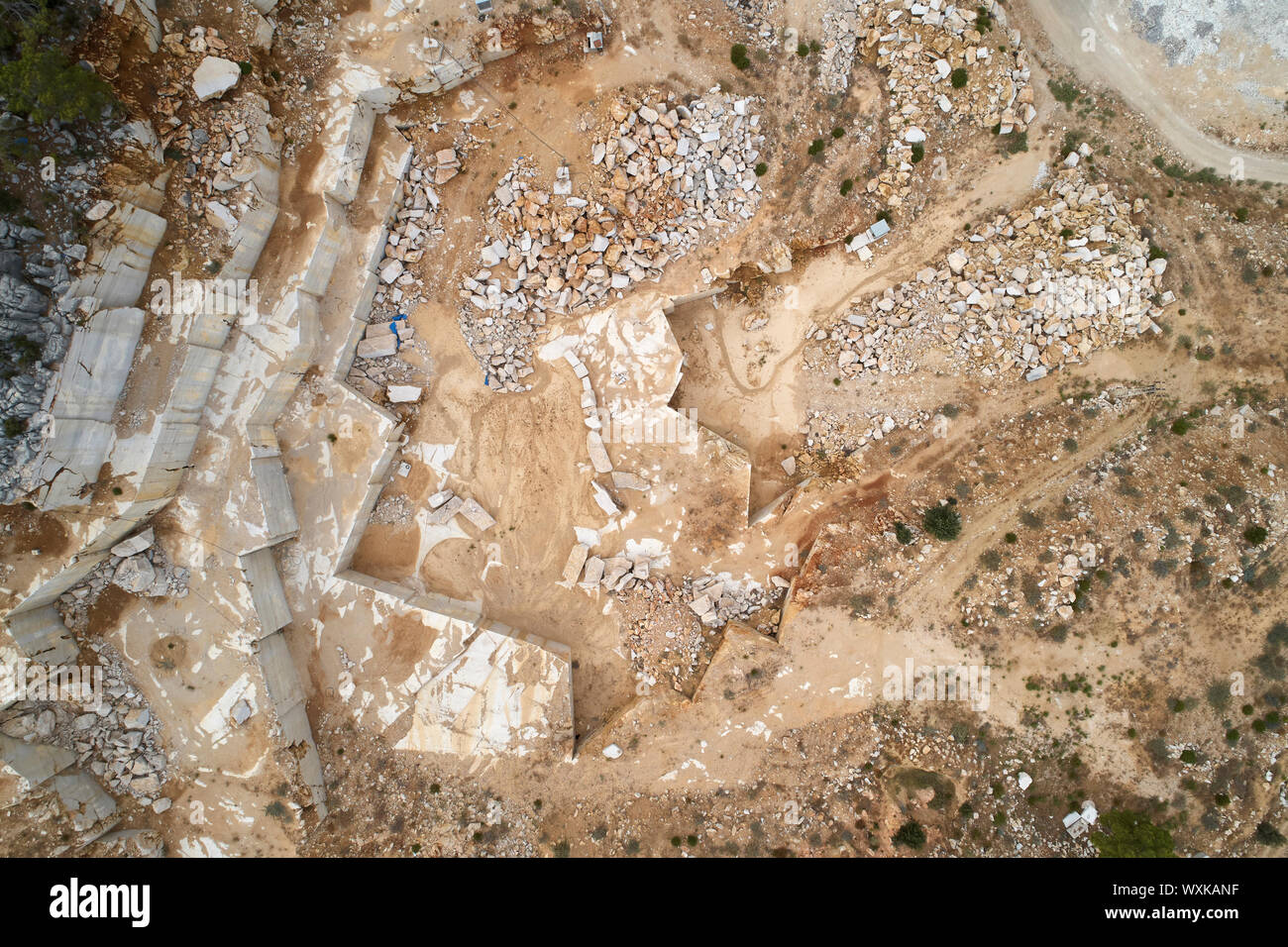 Marble quarry ledges. Terraces of cutted stone material. Aerial view ...