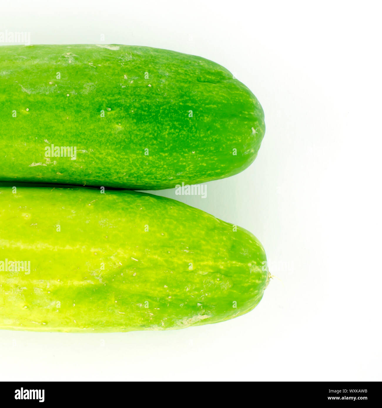 half Cucumber isolated on white background Stock Photo - Alamy