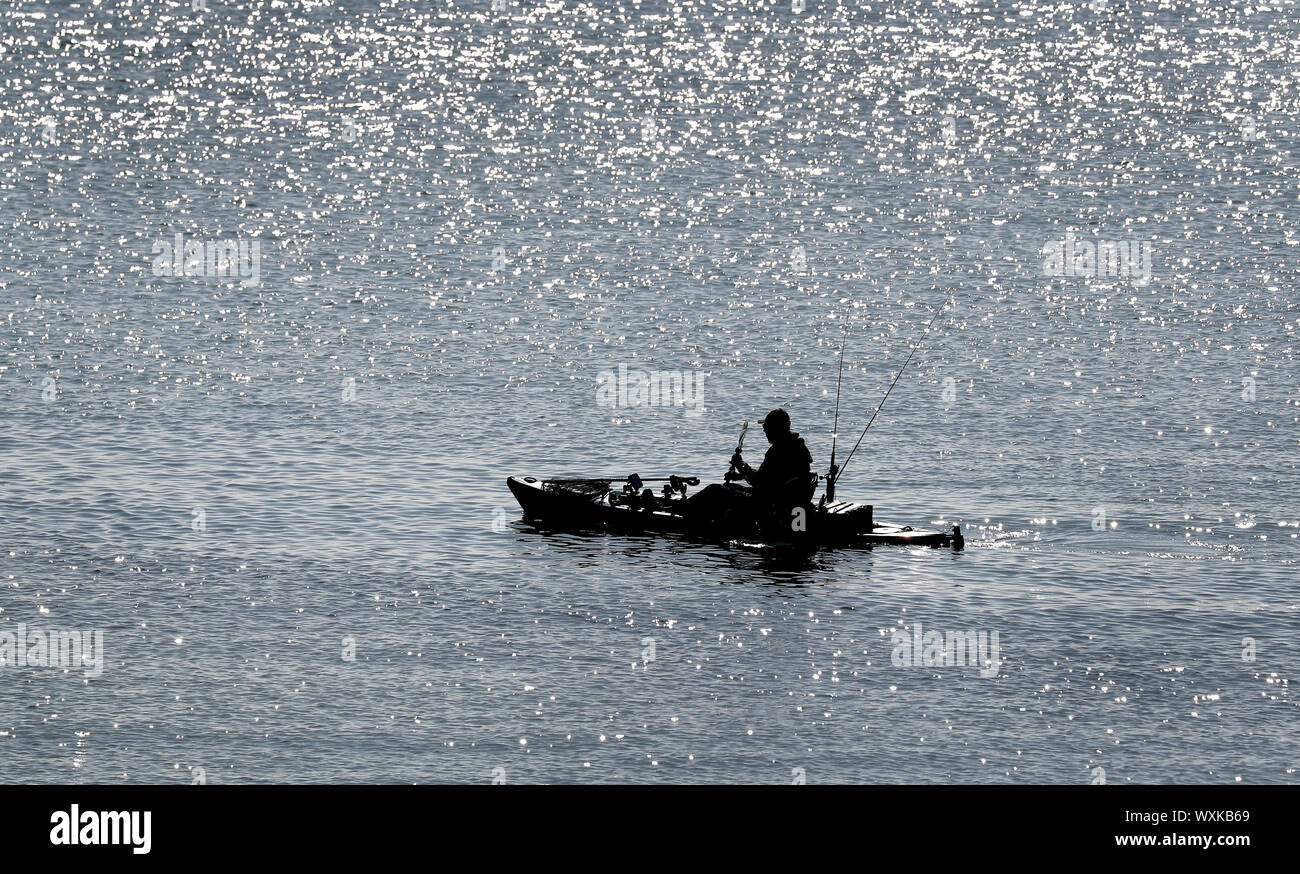 Man uses kayak to fish off the coast in sandgate hi-res stock ...