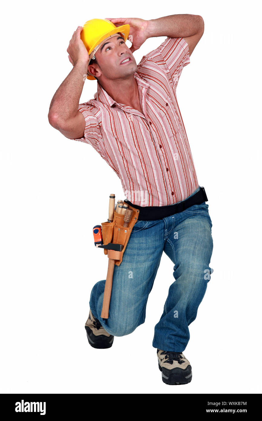A construction worker afraid of something falling Stock Photo - Alamy