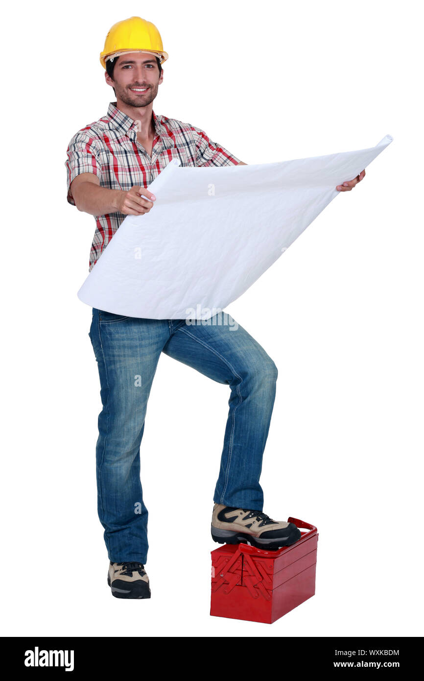 Builder with plans Stock Photo - Alamy