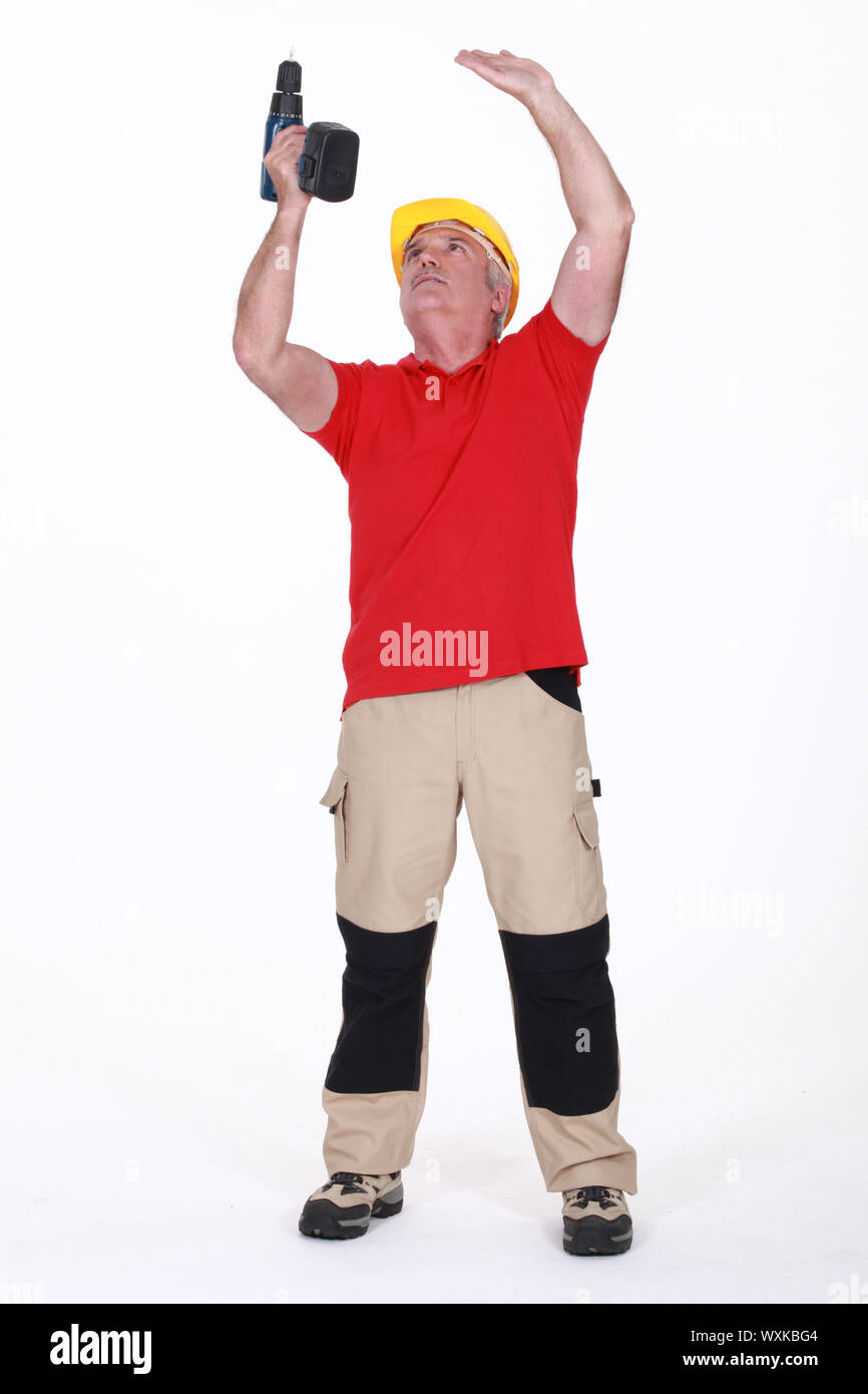 Handyman mature home improvement drilling hi-res stock photography and ...