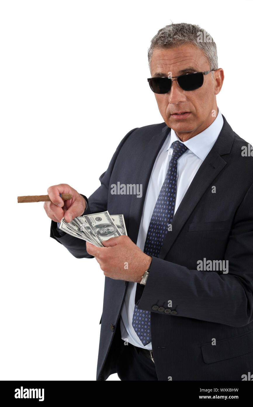 Banker money cigar hi-res stock photography and images - Alamy