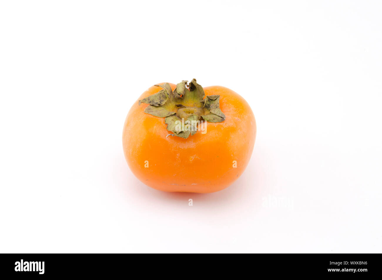 single persimmon isolated on white background Stock Photo - Alamy
