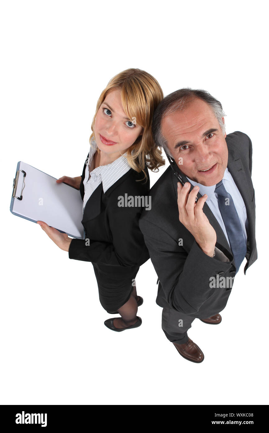 Assistant stood by boss ready to take notes Stock Photo - Alamy