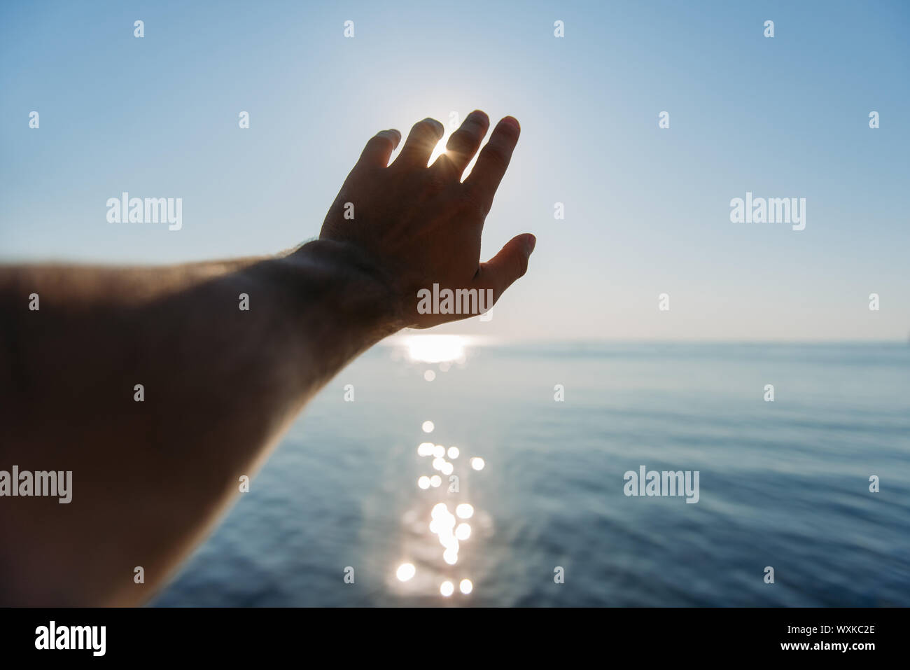 Hand reaching to sky hi-res stock photography and images - Alamy