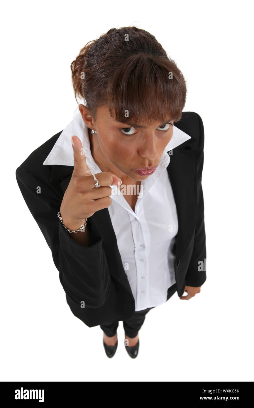 Stern businesswoman pointing finger Stock Photo - Alamy