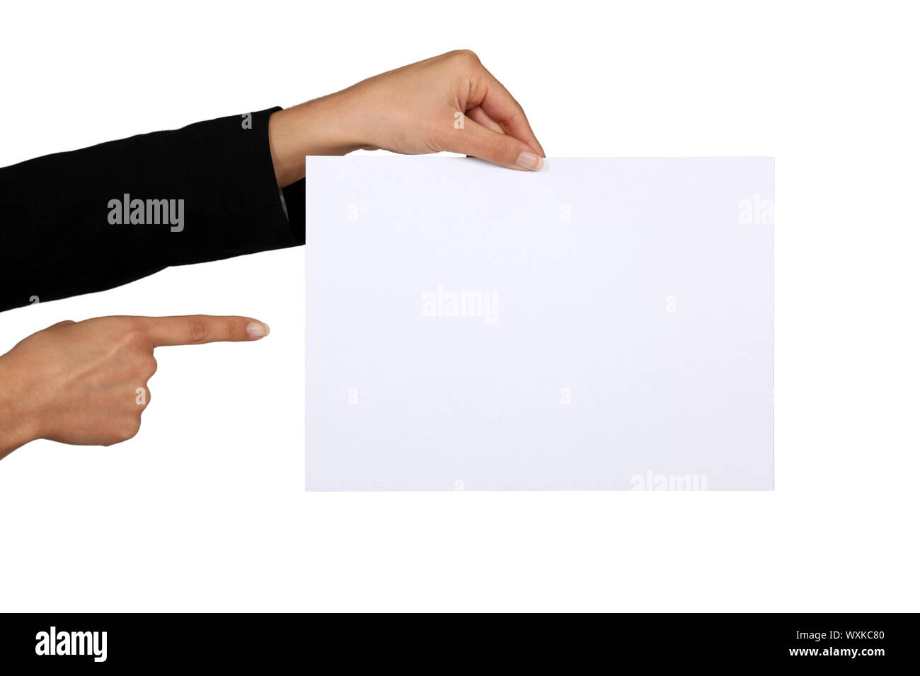 Businesswoman pointing at a blank piece of paper Stock Photo - Alamy