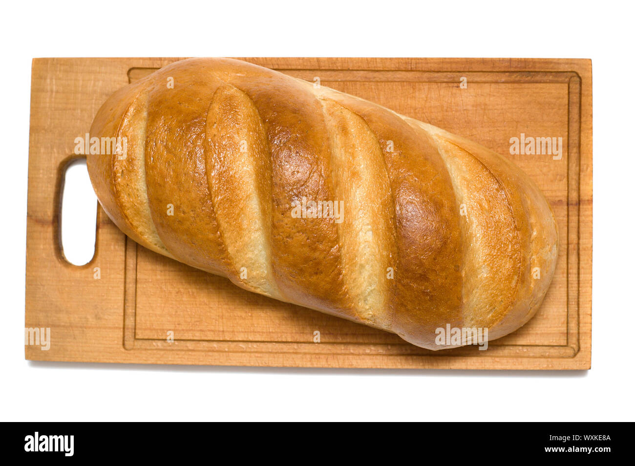 bread on breadboard isolated on white background Stock Photo - Alamy