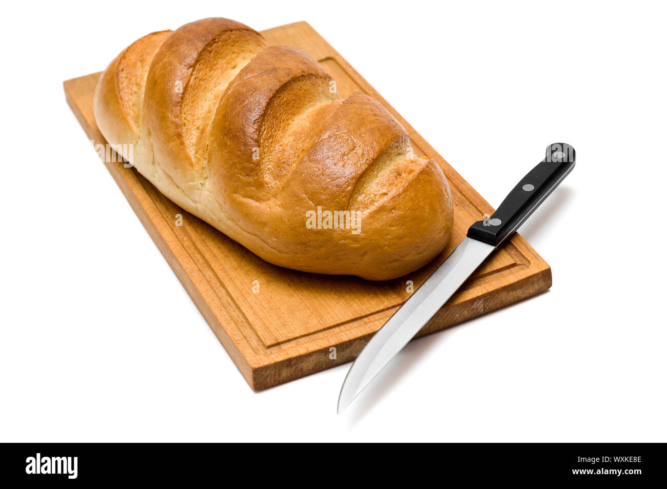 fresh natural bread with knife on breadboard Stock Photo - Alamy