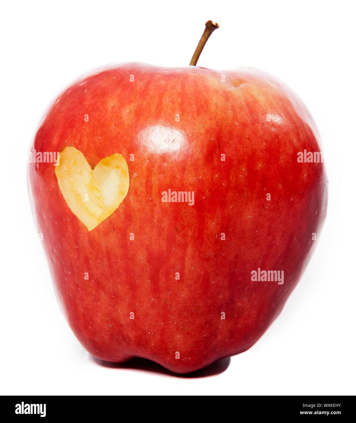 Apple with a heart isolated on white background Stock Photo - Alamy