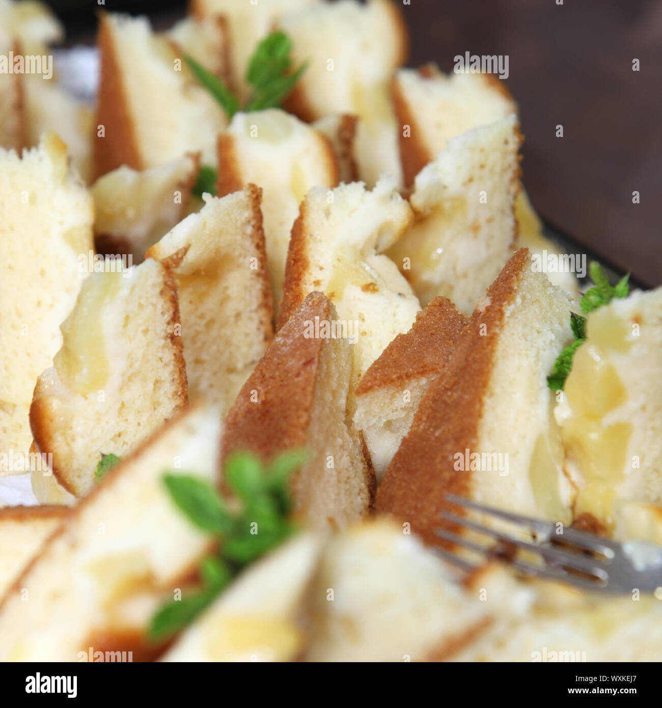 Delicious individual slices of apple cake on a buffet table arranged in ...