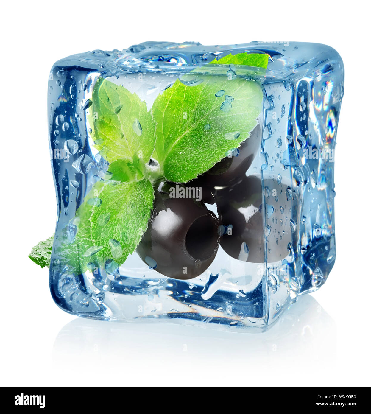 Olives in ice cube isolated on a white background Stock Photo - Alamy