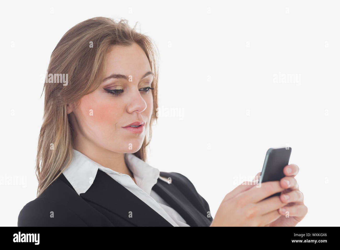 Beautiful business woman using cell phone against white background ...