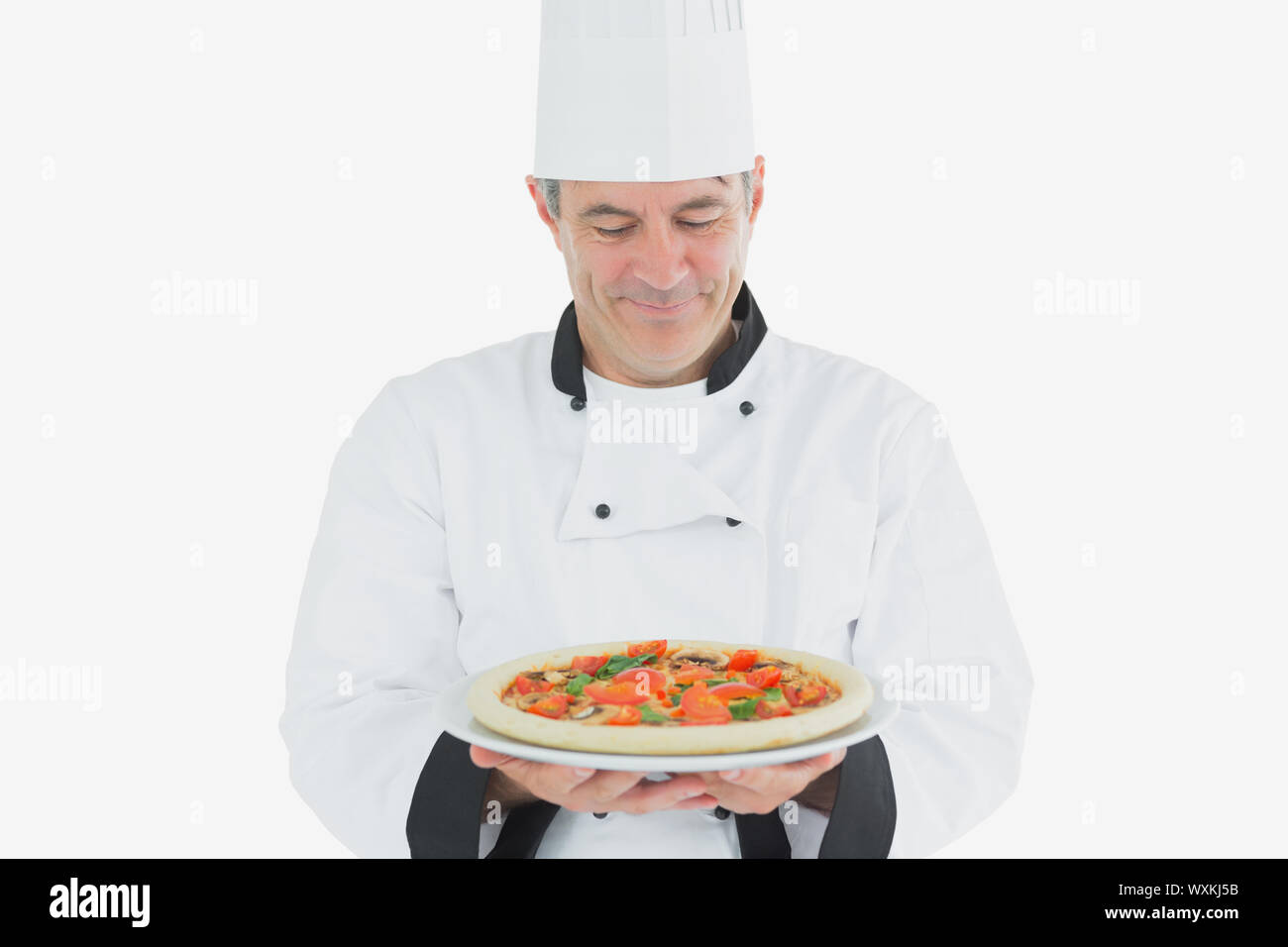 Mature chef holding pizza over white background Stock Photo - Alamy