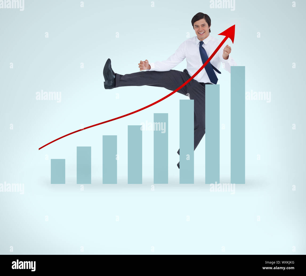 Smiling man in suit jumping over the graph with red curve against a ...