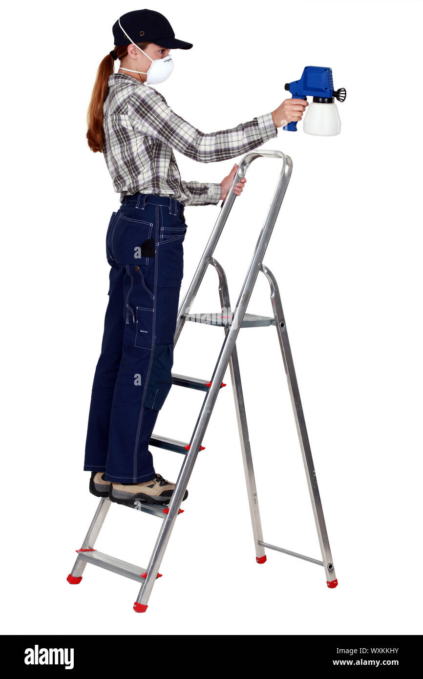 Woman painter using a spray Stock Photo - Alamy