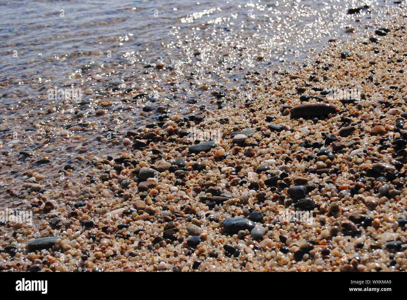 Waves and transparent water on the sand in the beach. Texture. Water ...