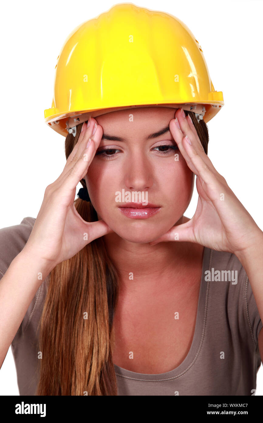 Construction worker with a headache Stock Photo - Alamy