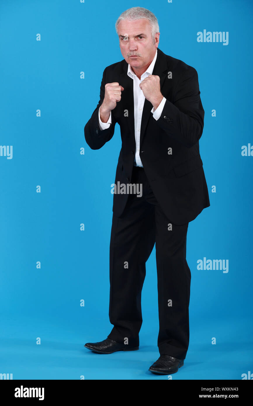 Middle-aged businessman boxing Stock Photo - Alamy
