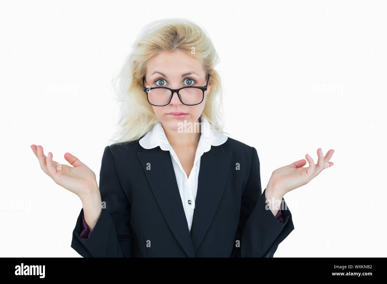 Portrait of a young business woman gesturing do not know sign against ...
