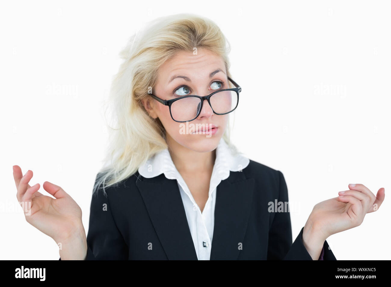 Young business woman gesturing do not know sign against white ...