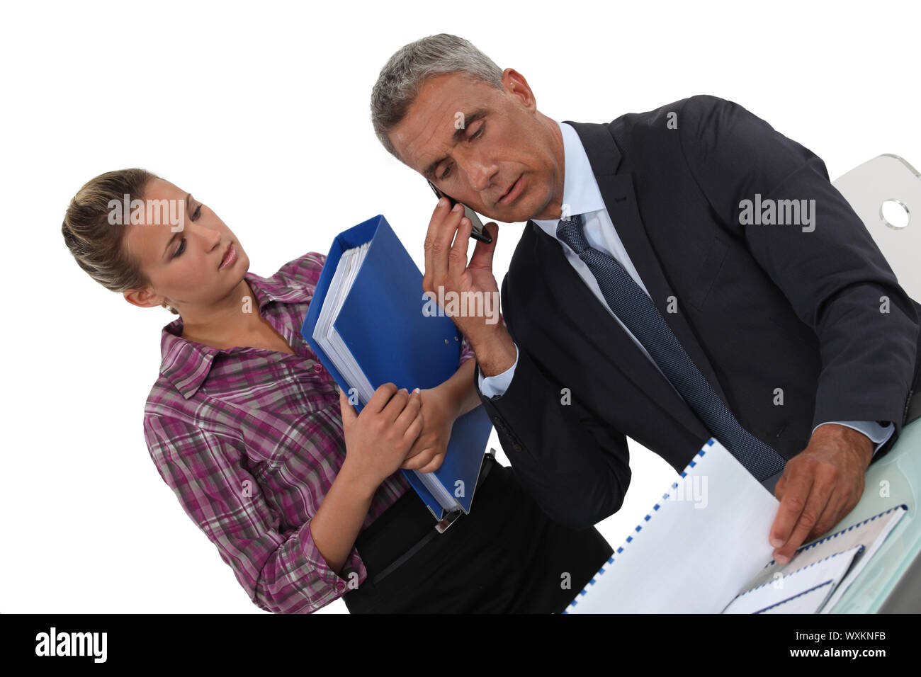 Boss and assistant working closely together Stock Photo - Alamy
