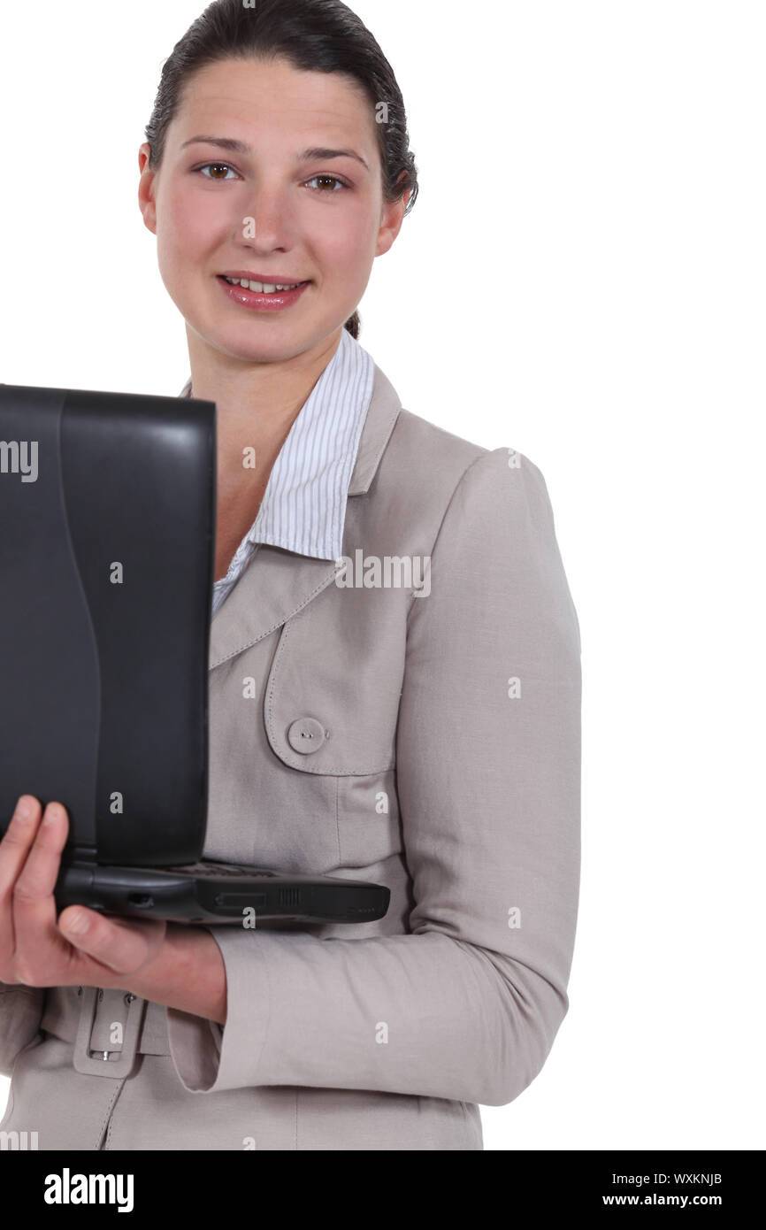 Woman carrying her laptop Stock Photo - Alamy