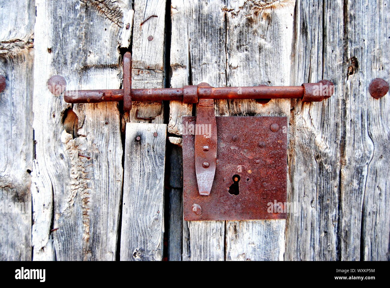 Old door with rusty bolt, rusted, oxidized hinge, old wood Stock Photo ...