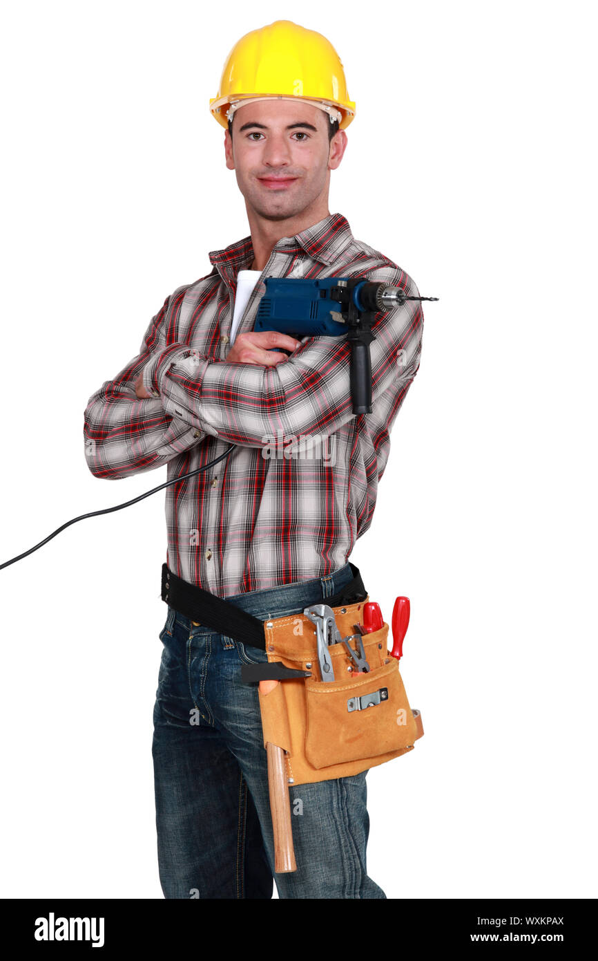 Proud tradesman posing with his electric screwdriver Stock Photo - Alamy