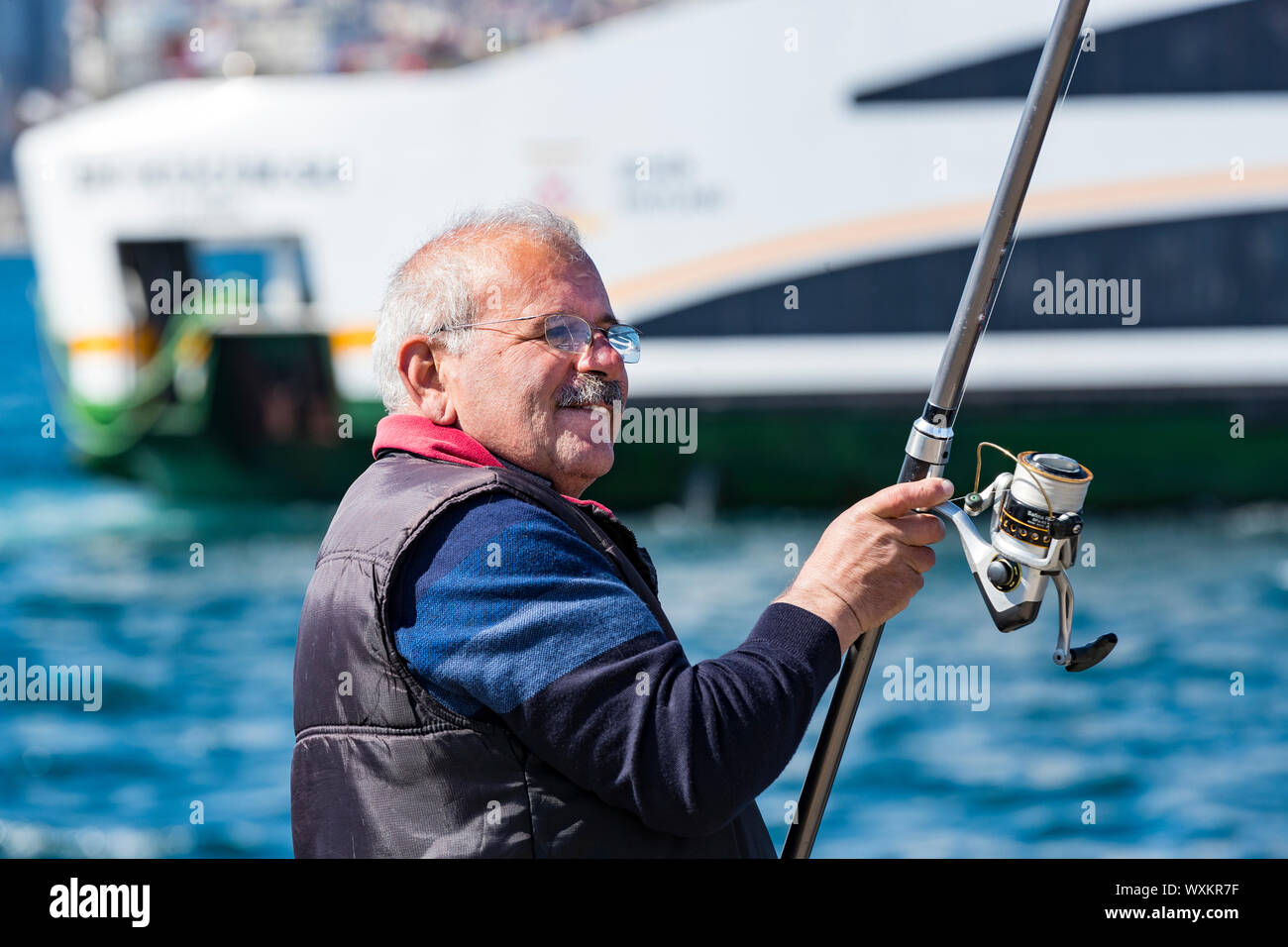 ISTANBUL, TURKEY - 3 APRIL , 2017: Fishermen are fishing on the banks ...