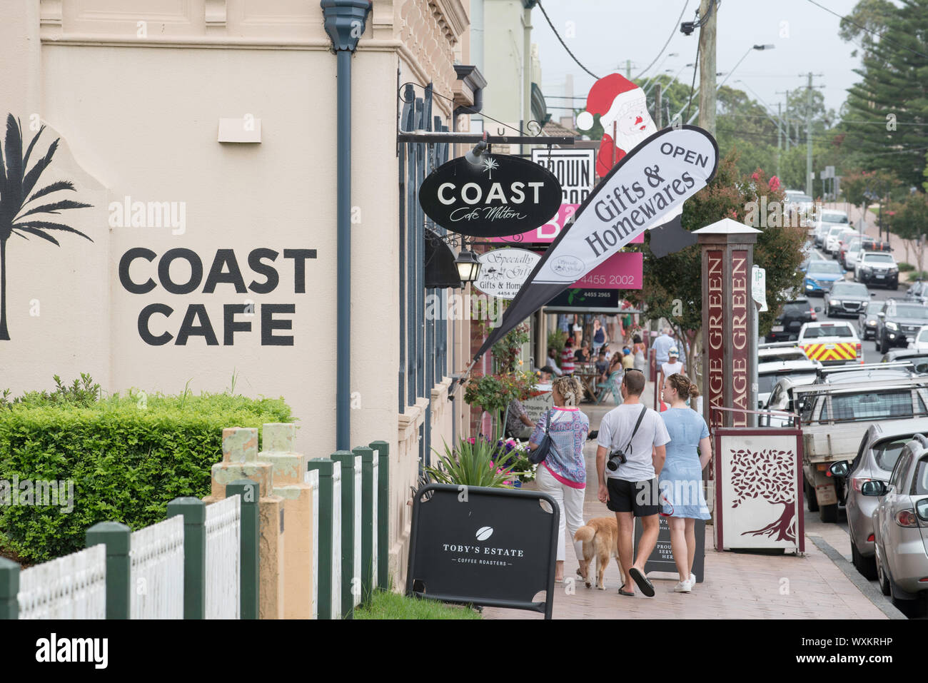 Visitors and locals browse and eat at the shops and outdoor cafes along ...