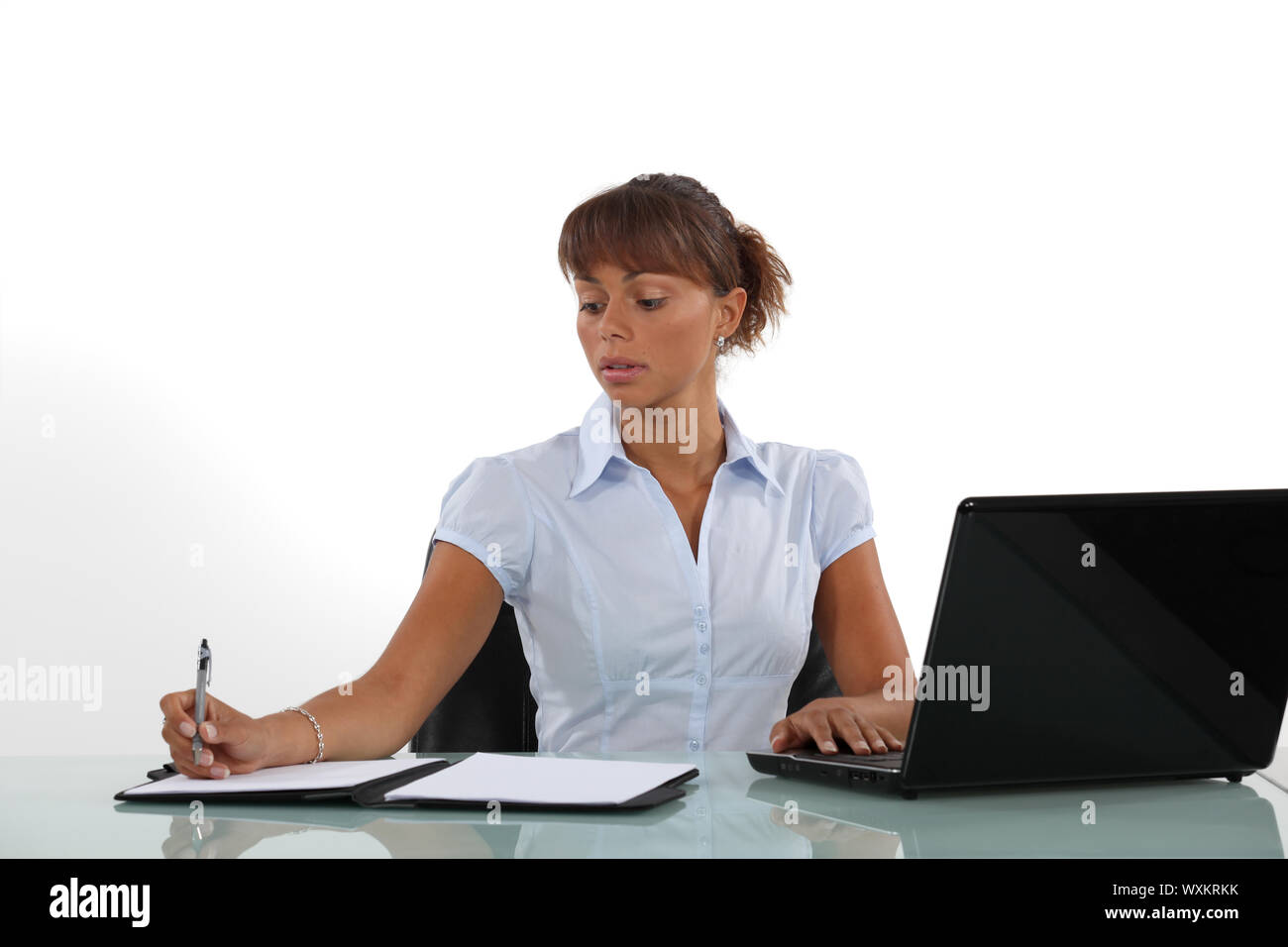 Woman taking notes Stock Photo - Alamy