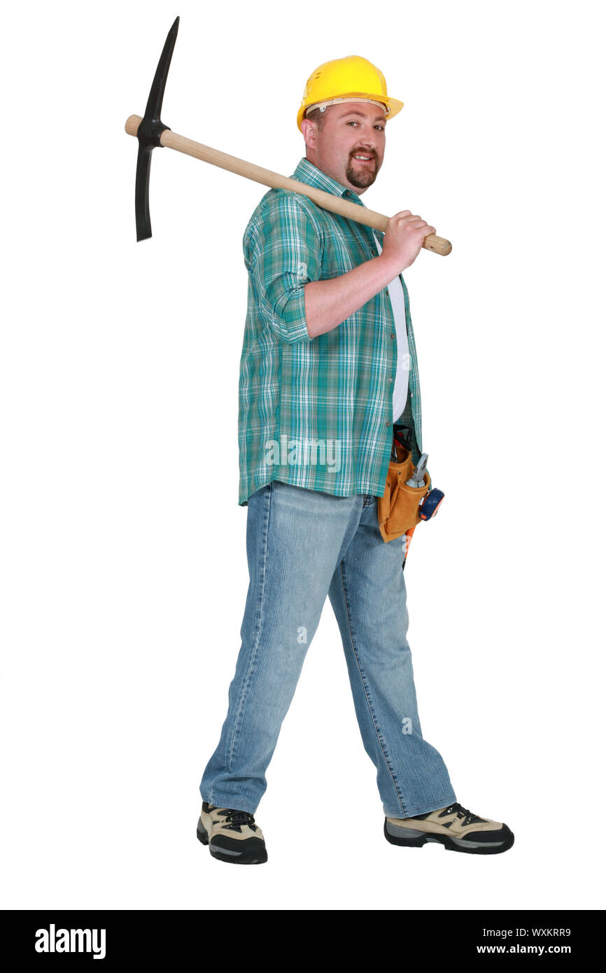 Man resting pick-axe over his shoulder Stock Photo - Alamy