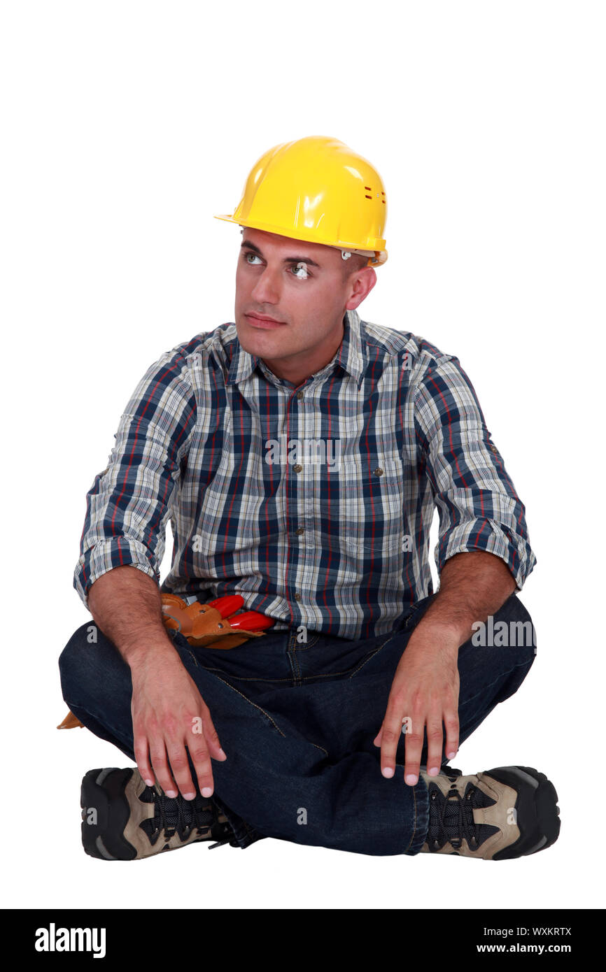 A pensive construction worker Stock Photo - Alamy