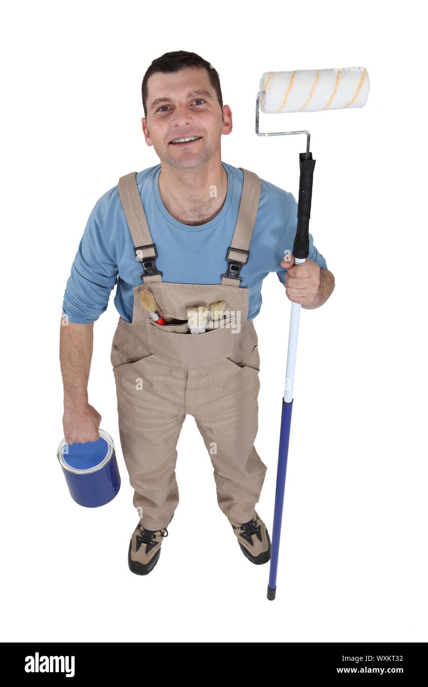Cheerful painter holding paint Cut Out Stock Images & Pictures - Alamy