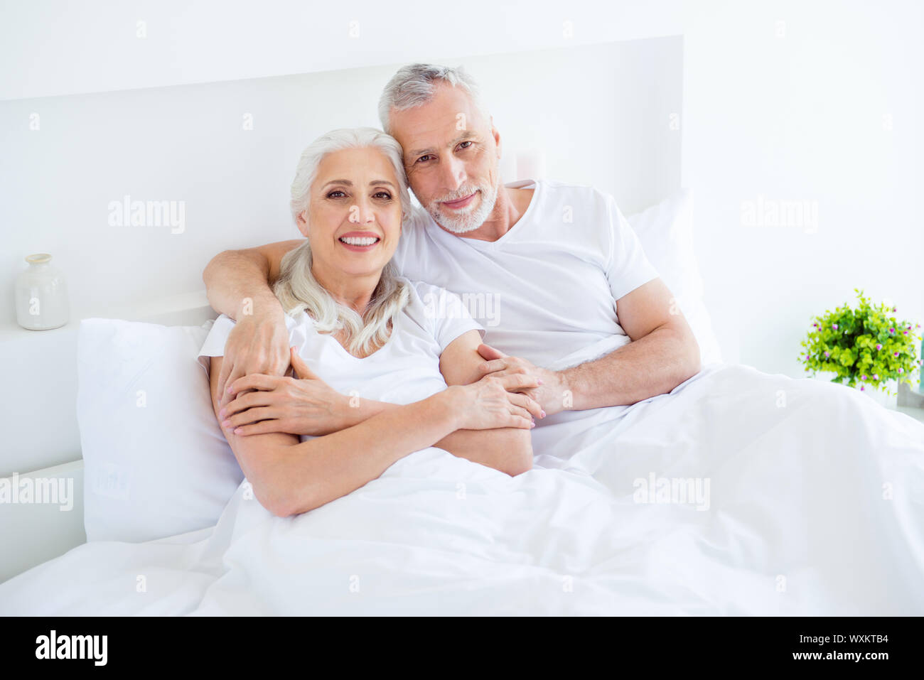 Two carefree, careless people with grey hair cuddle to each othe Stock ...