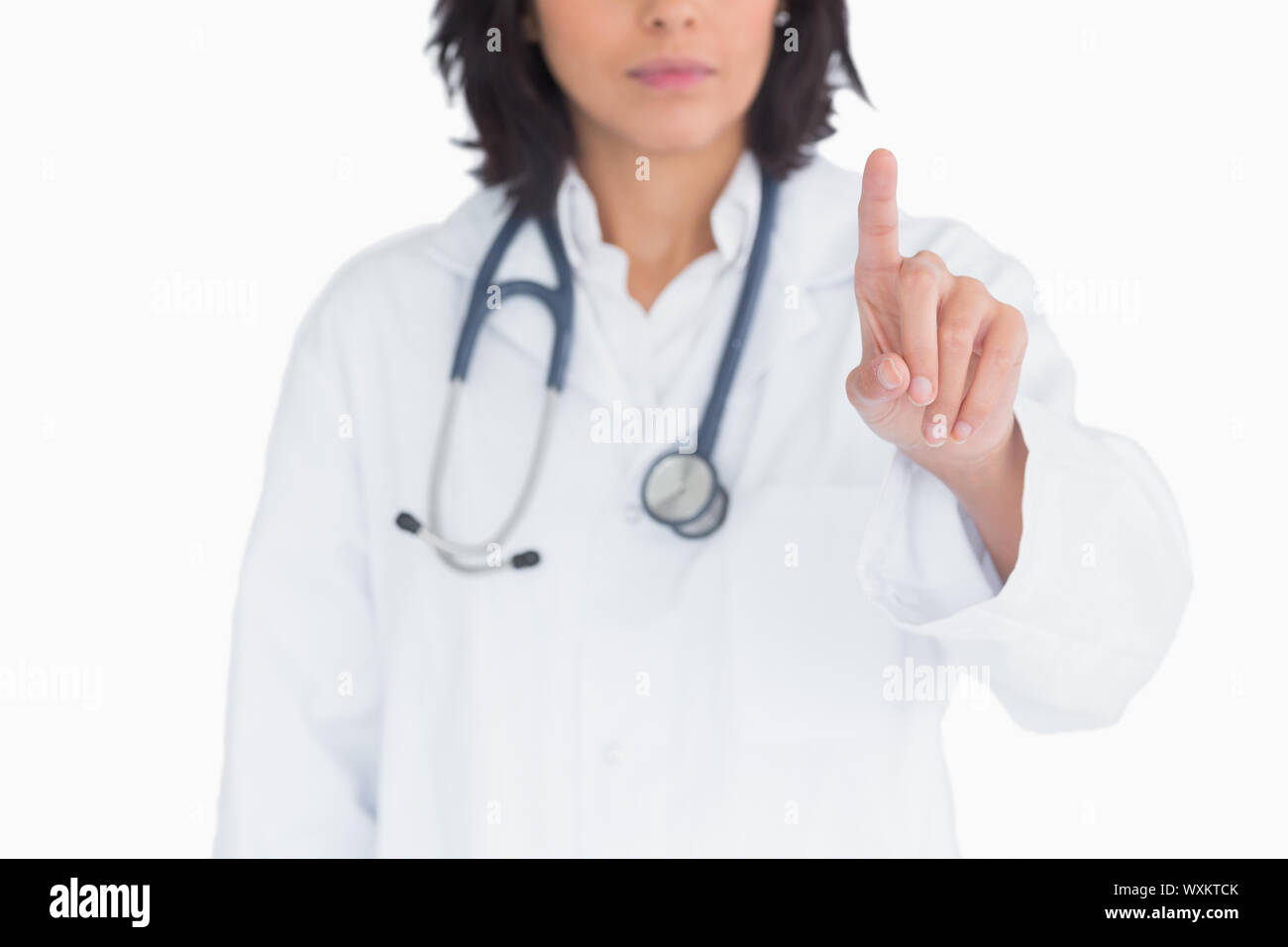 Doctor pointing the finger in the air on white background Stock Photo ...