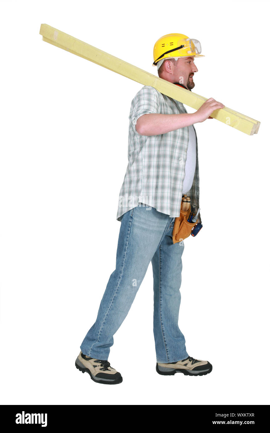Worker carrying wooden beam hi-res stock photography and images - Alamy