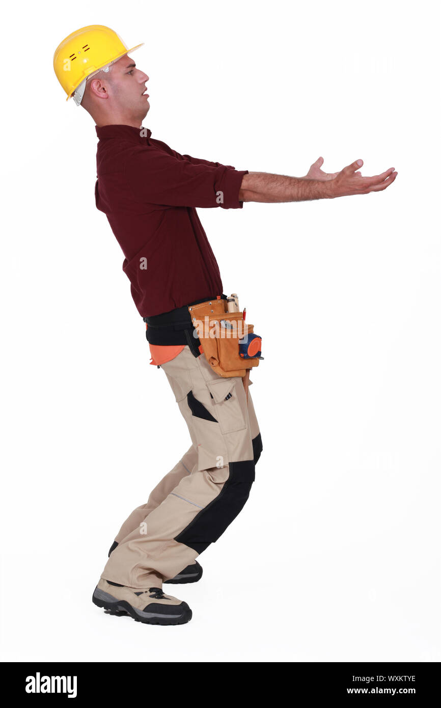 Construction worker carrying something Stock Photo - Alamy