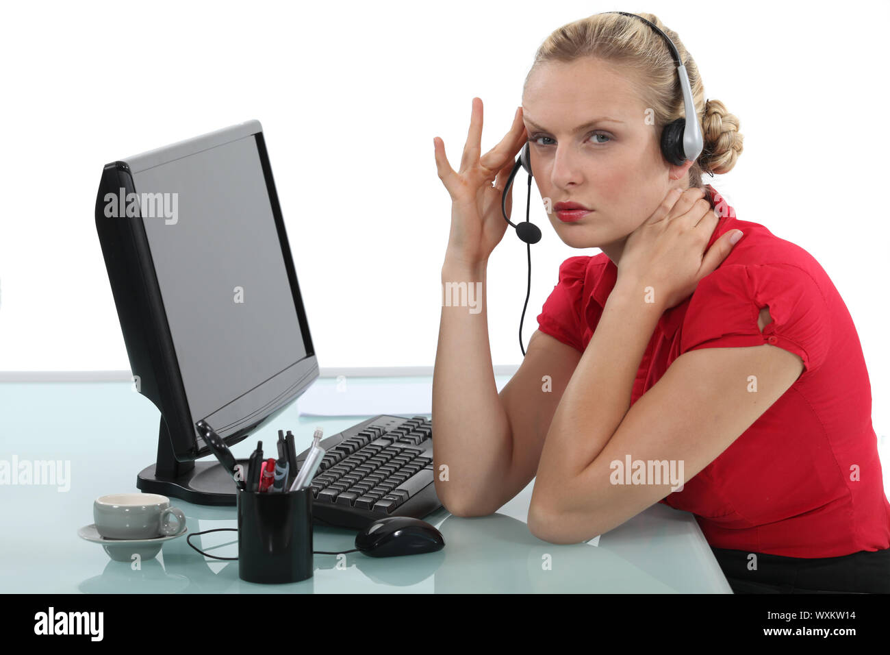 Stressed call-center worker Stock Photo - Alamy