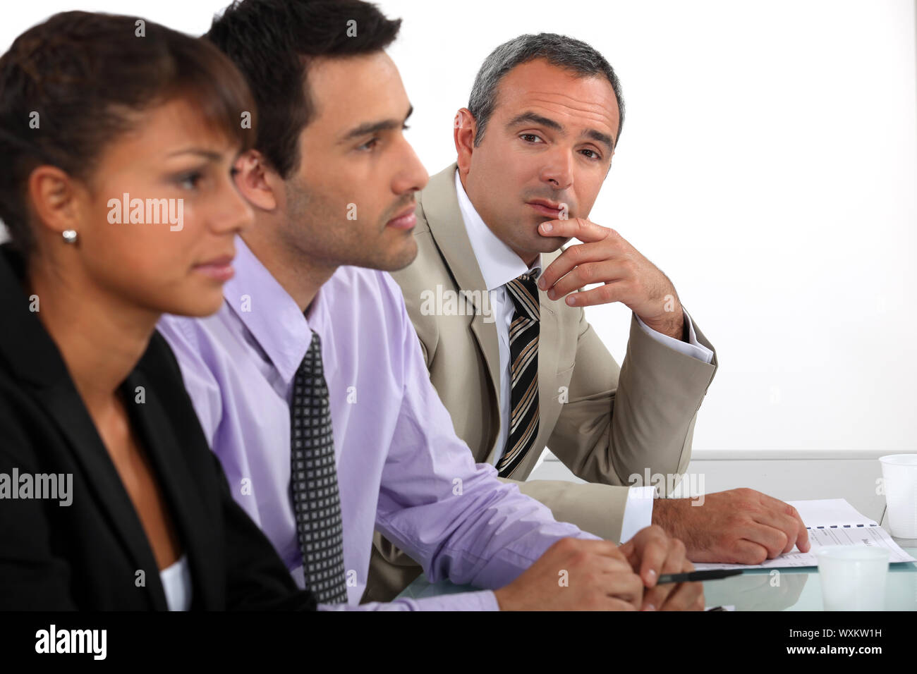 Three people on interview panel Stock Photo - Alamy