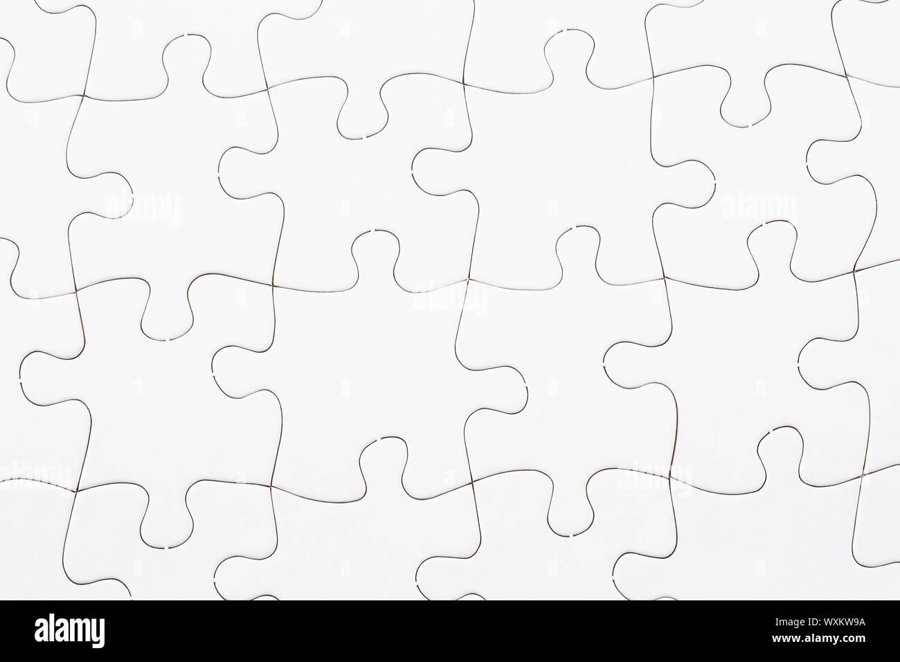 White jigsaw puzzle background Stock Photo - Alamy
